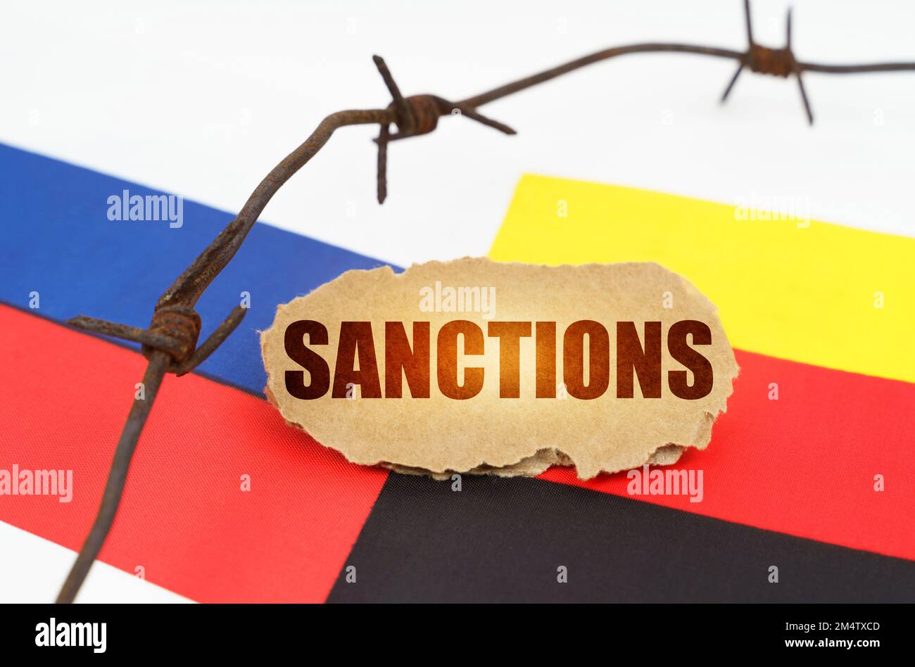 Political concept. On the flags of Germany and Russia lies a cardboard ...