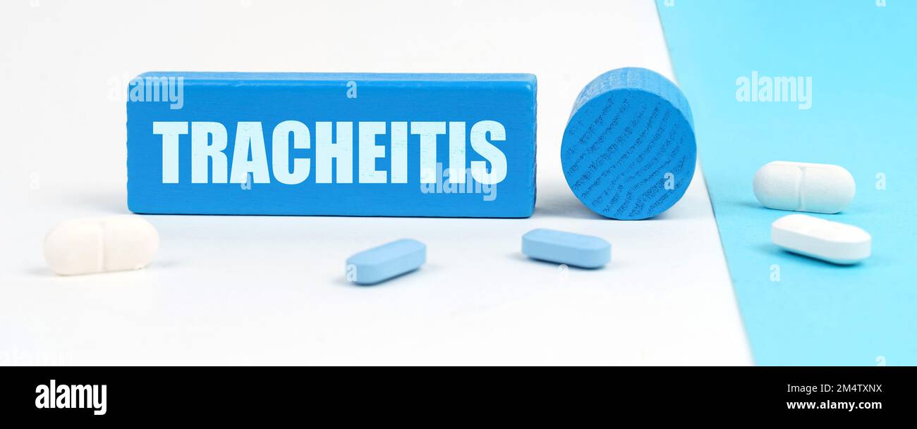 Medical concept. On a white and blue surface are pills, a stethoscope ...