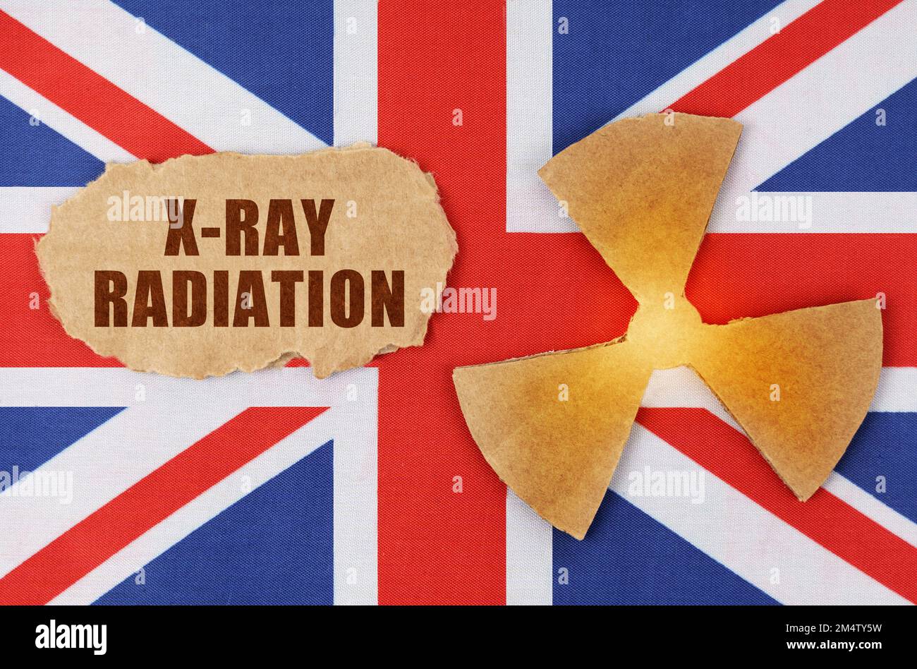 Industry and radiation concept. On the flag of Great Britain, there is ...