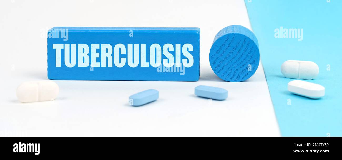 Medical concept. On a white and blue surface are pills, a stethoscope ...