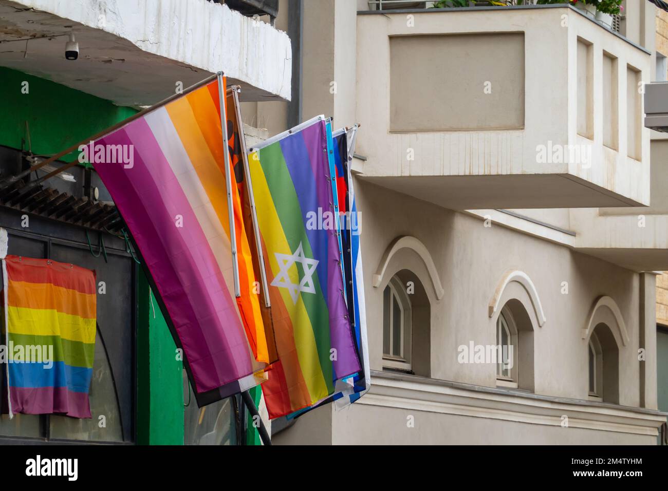 Bunch of various LGBT flags with Star of David hanging on poles outside ...