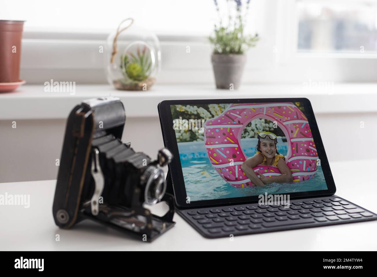 tablet, photo camera on an office desk Stock Photo - Alamy