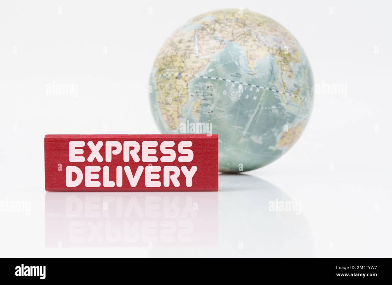 Business and transport concept. Near the globe is a red plaque with the ...