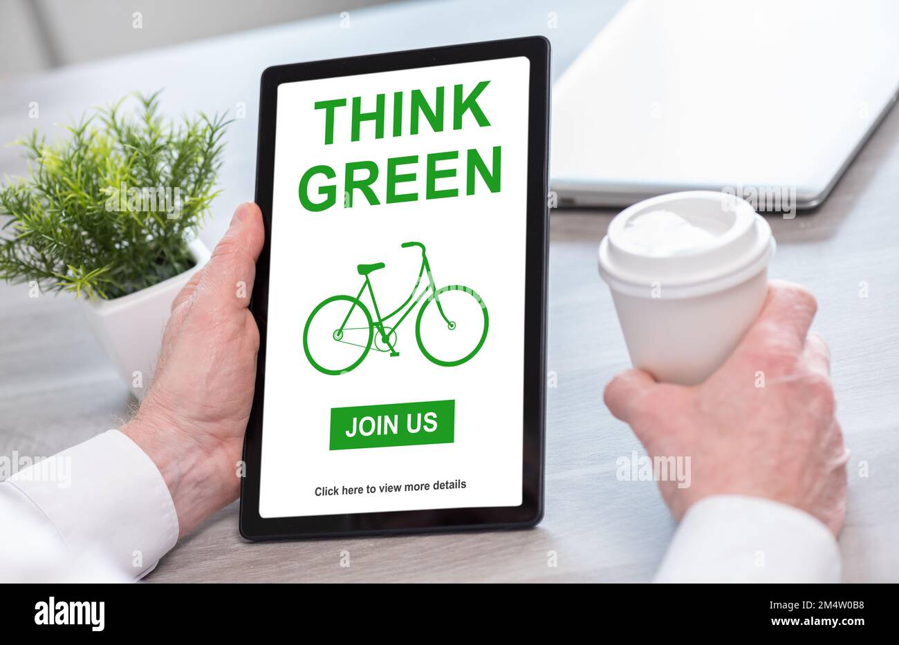 Tablet screen displaying a think green concept Stock Photo - Alamy