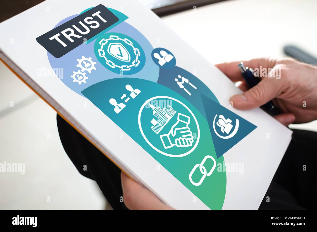 Trust concept on a paper held by a hand Stock Photo - Alamy