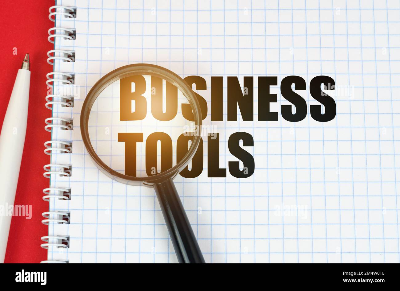 Business and finance concept. On the red surface is a pen, a notepad ...