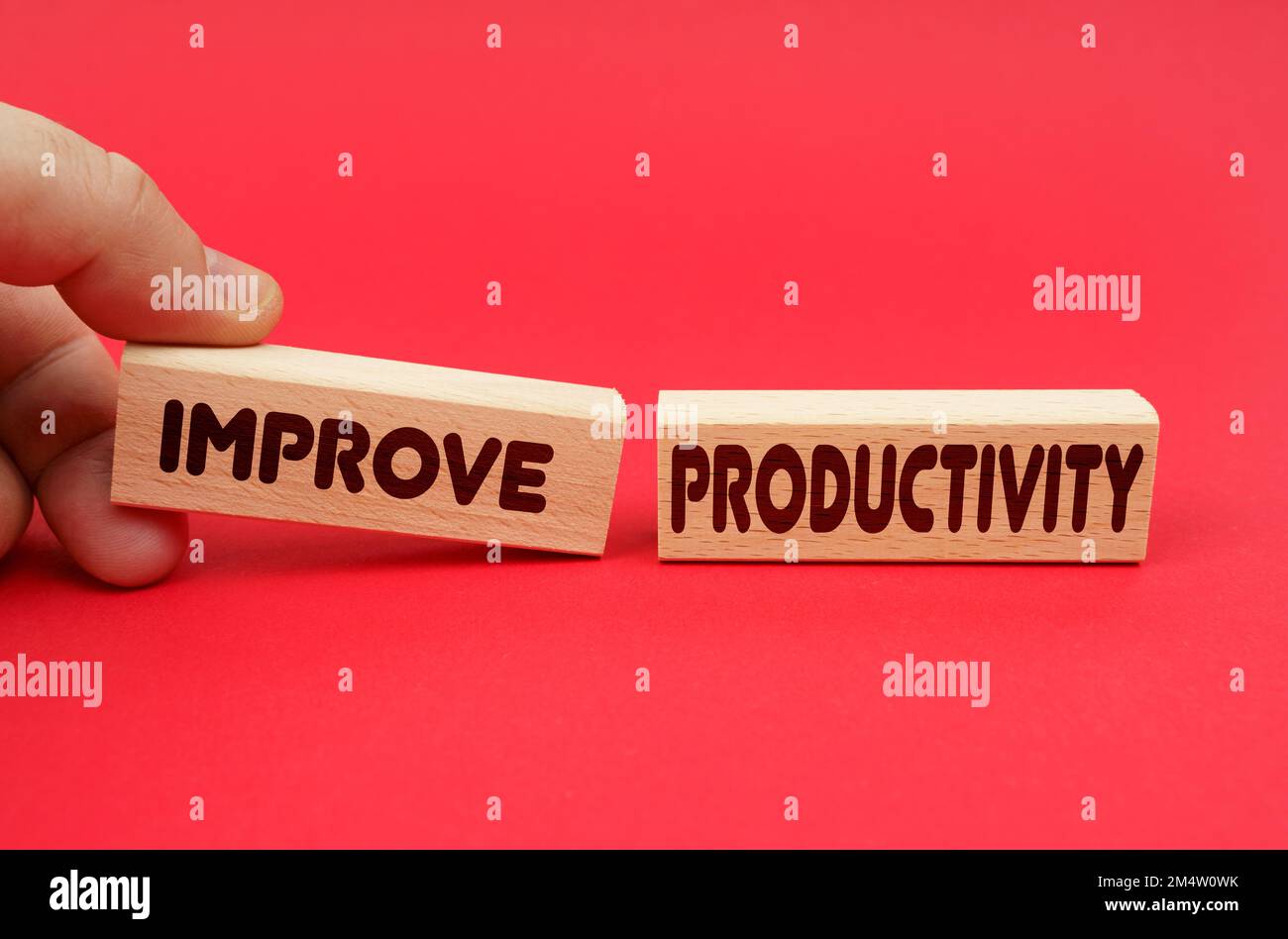 Business concept. On a red background, wooden blocks, one of them in ...