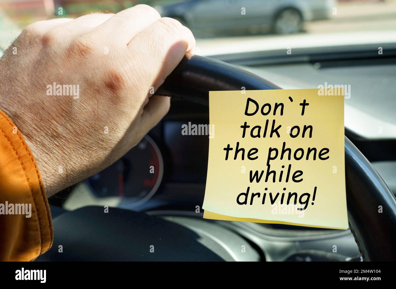 The concept of transport security. A man holds on to the steering wheel ...