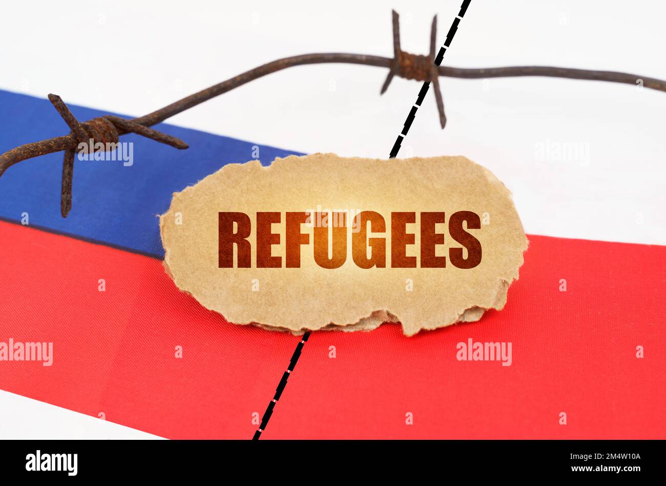 Political concept. On the flags of Poland and Russia lies a cardboard ...