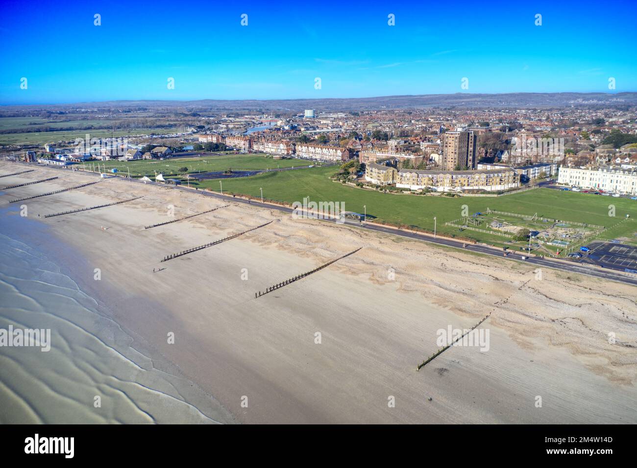 Aerial view of the wide expanse of Littlehampton East Beach and Green ...