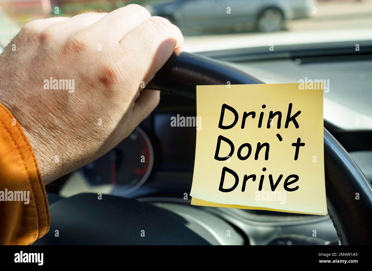 The concept of transport security. A man holds on to the steering wheel ...