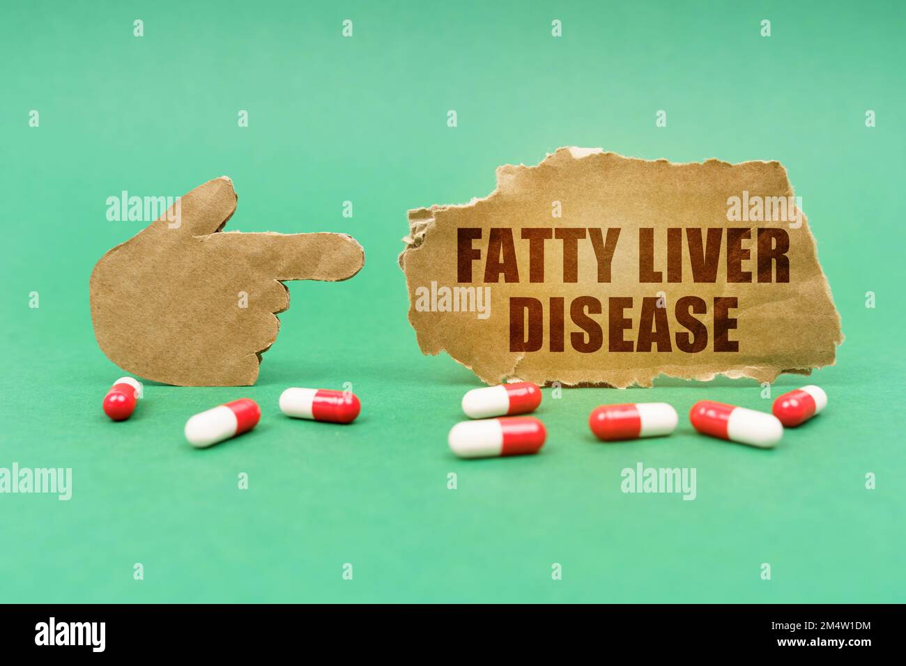 Medical concept. On the green surface of the tablet and a hand pointing ...