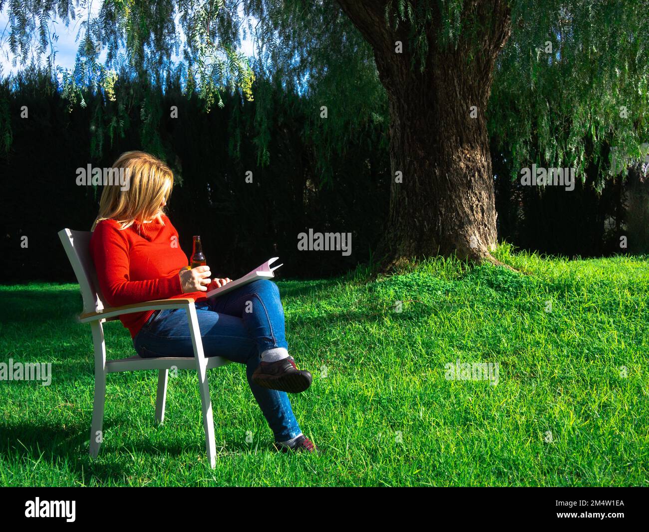 Mature woman sunbathing hi-res stock photography and images - Alamy