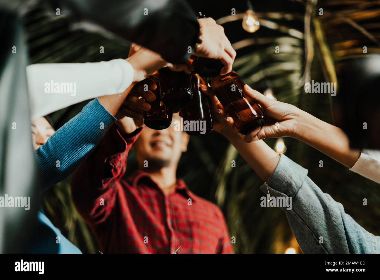 Group Asian people happy friends celebrating and clinking with bottles ...