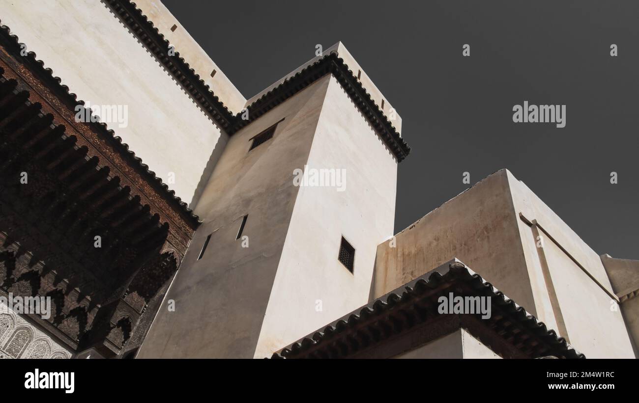 A low-angle shot of the upper building wall of Madrasa. Morocco Stock ...