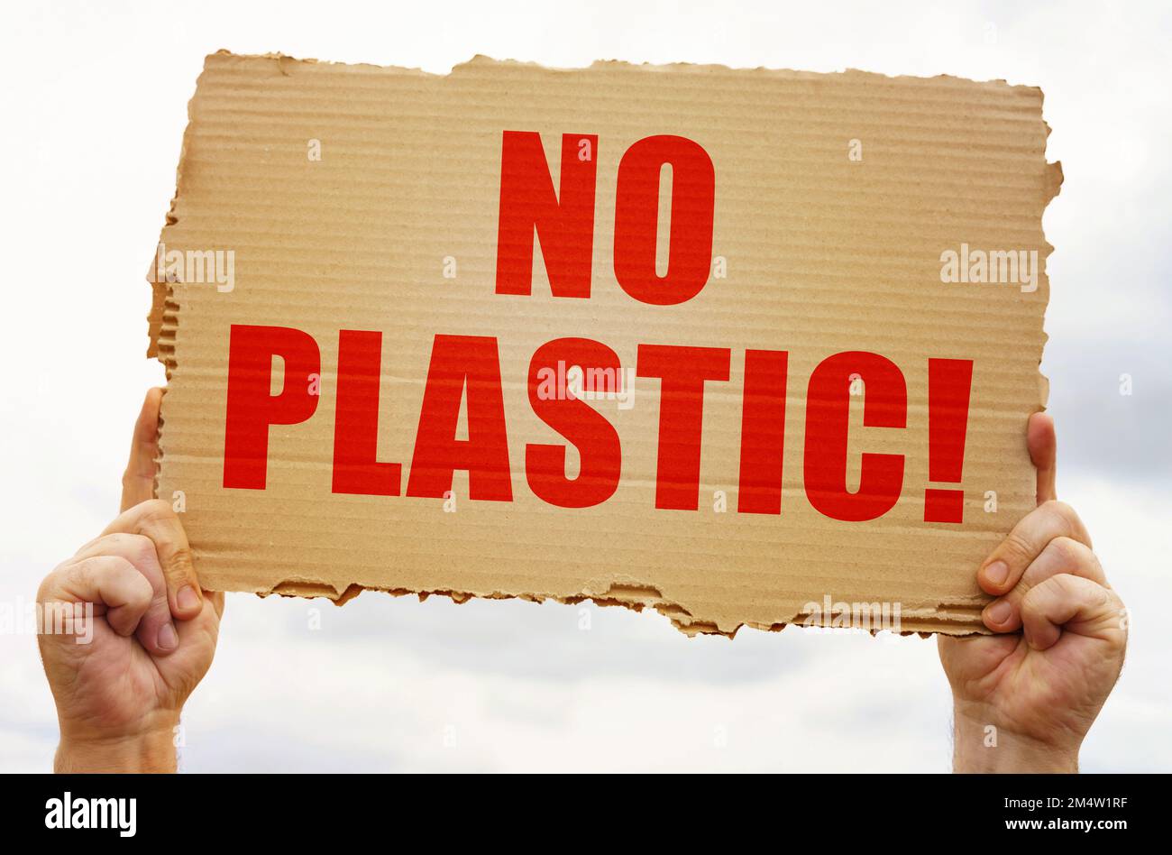 Ecological concept. In the hands of a man is a cardboard sign with the ...