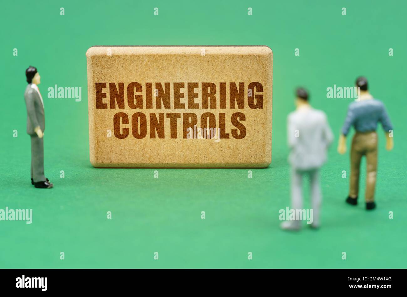 Security and insurance concept. On the green surface are figures of ...