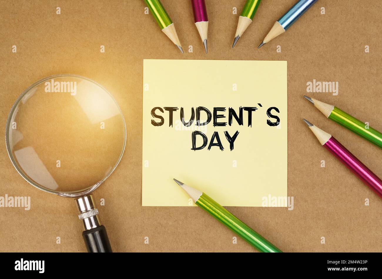 Education concept. On the table are pencils, a magnifying glass and a ...