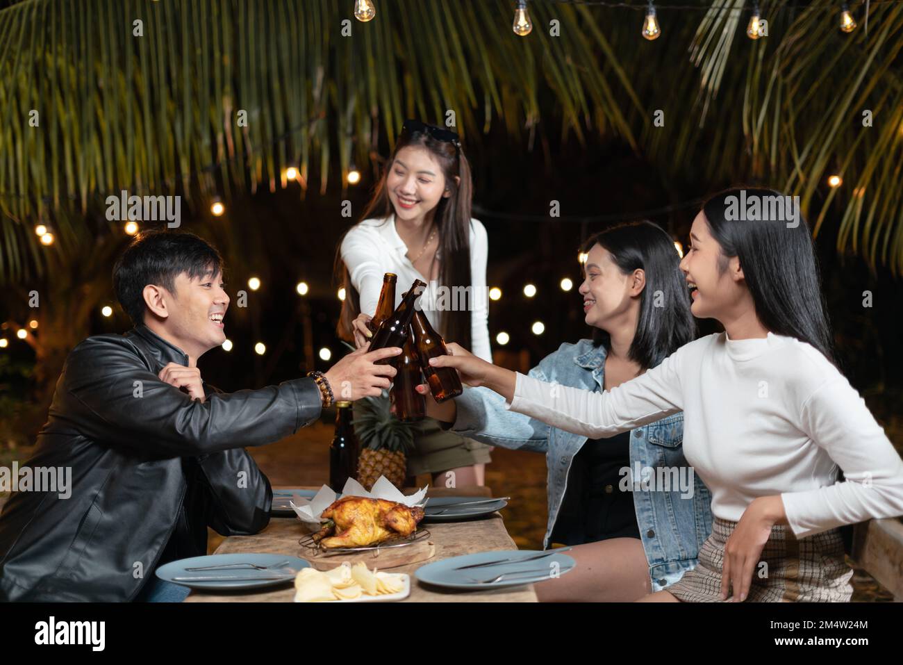 Beautiful girls join in drinking beer to celebrate a party in the ...