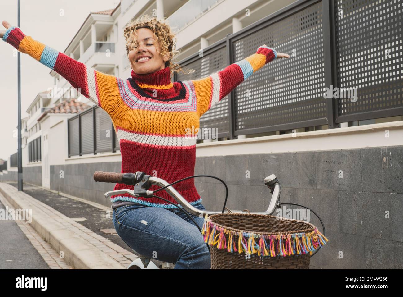 Happiness concept with overjoyed female outstretching arms riding a ...