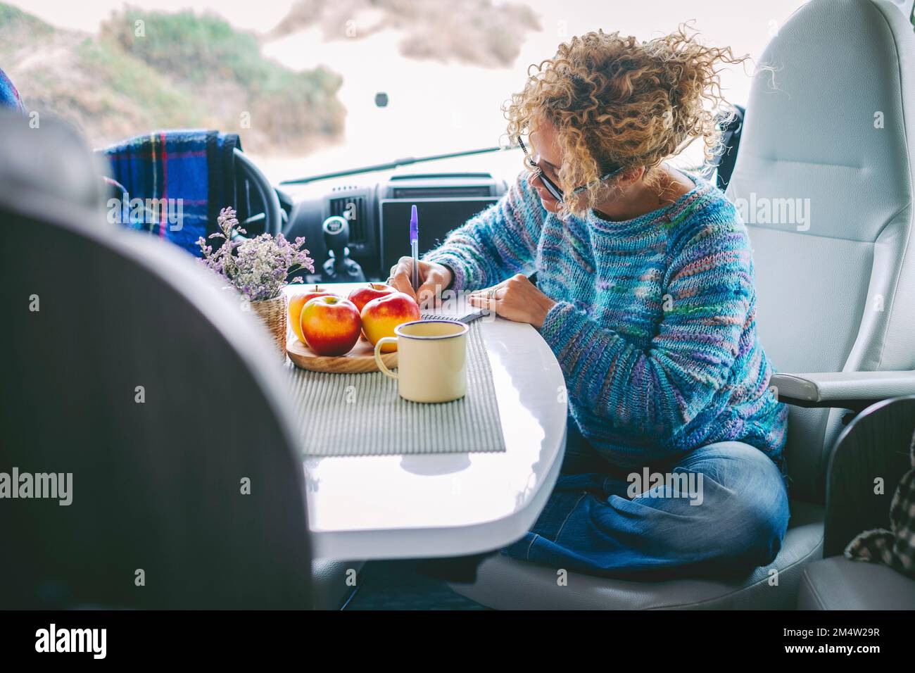 Travel vanlife lifestyle people concept. One woman having breakfast and ...