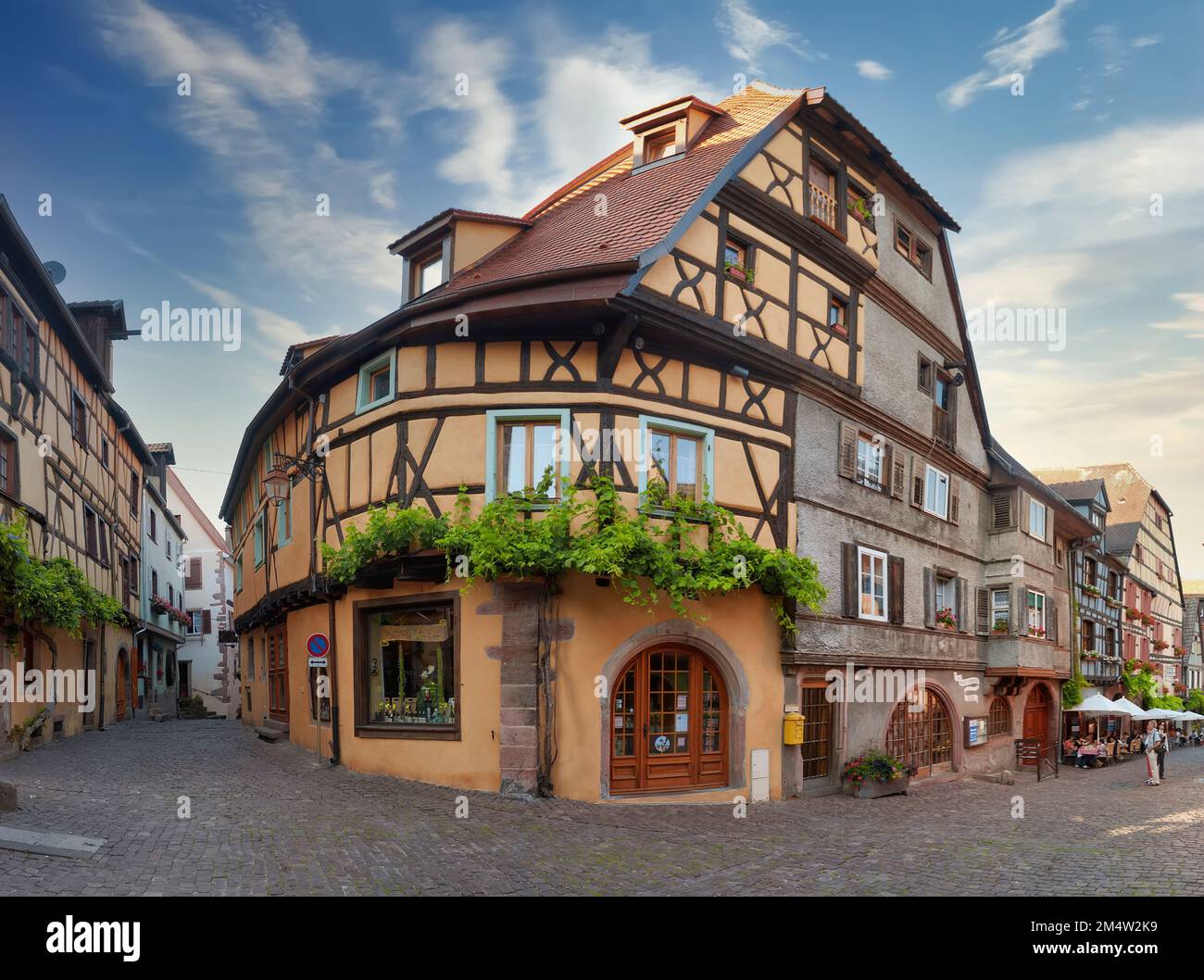 Traditional colorful half-timbered houses in Riquewihr village , Alsace ...