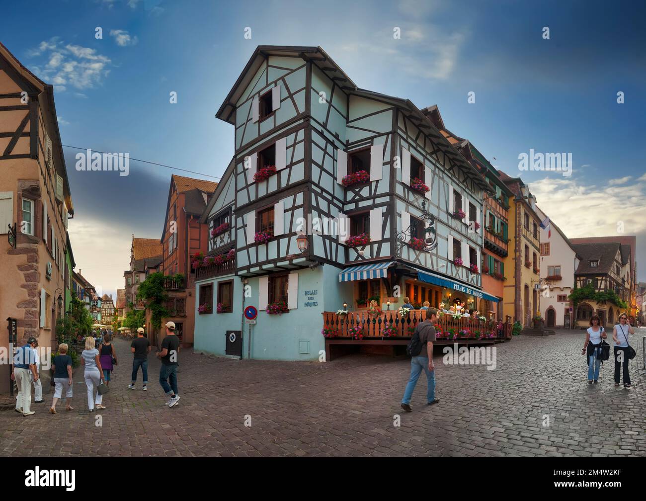 Traditional colorful half-timbered houses in Riquewihr village , Alsace ...