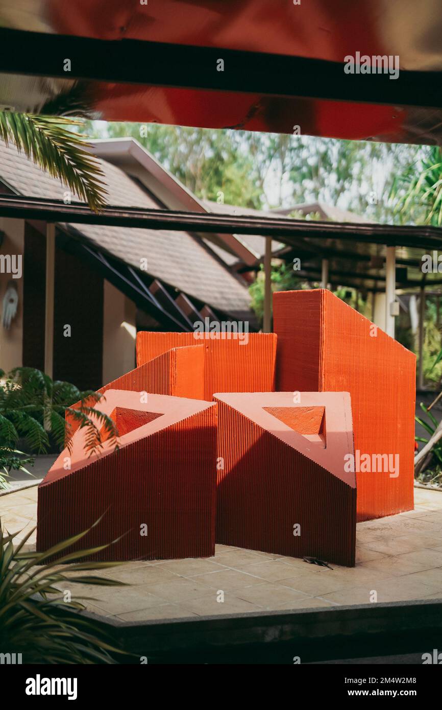 A vertical of beautiful triangular geometric shapes in the courtyard of ...