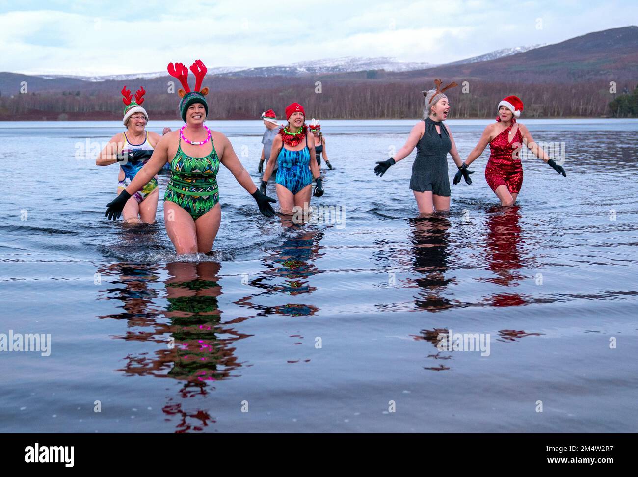 Members of the Loch Insh Dippers wild swim group take part in a ...