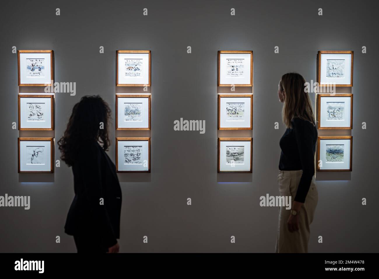 Gallery assistants look at artwork featuring in the 'Look How Far We've ...