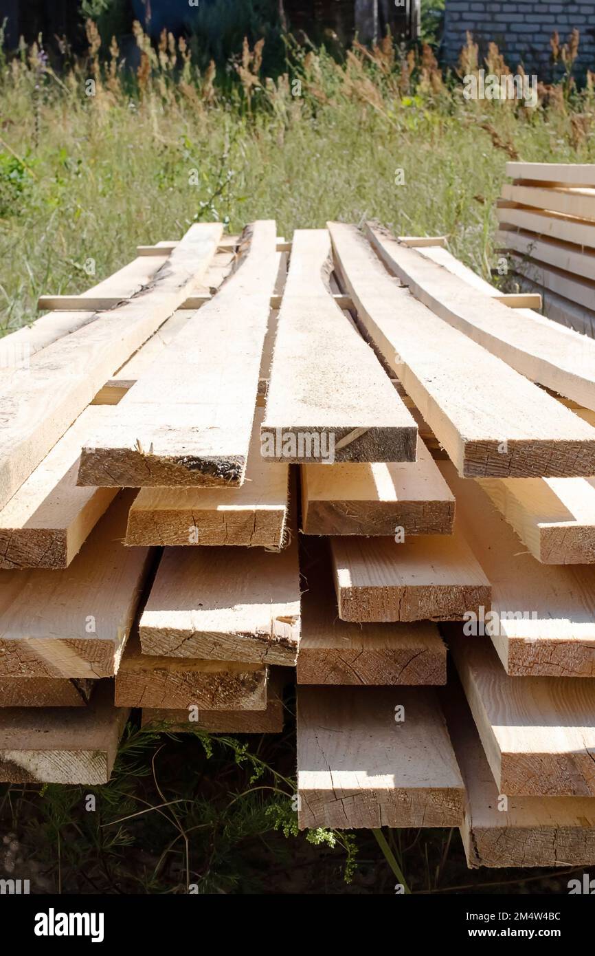 Folded finished boards at the sawmill close up Stock Photo - Alamy