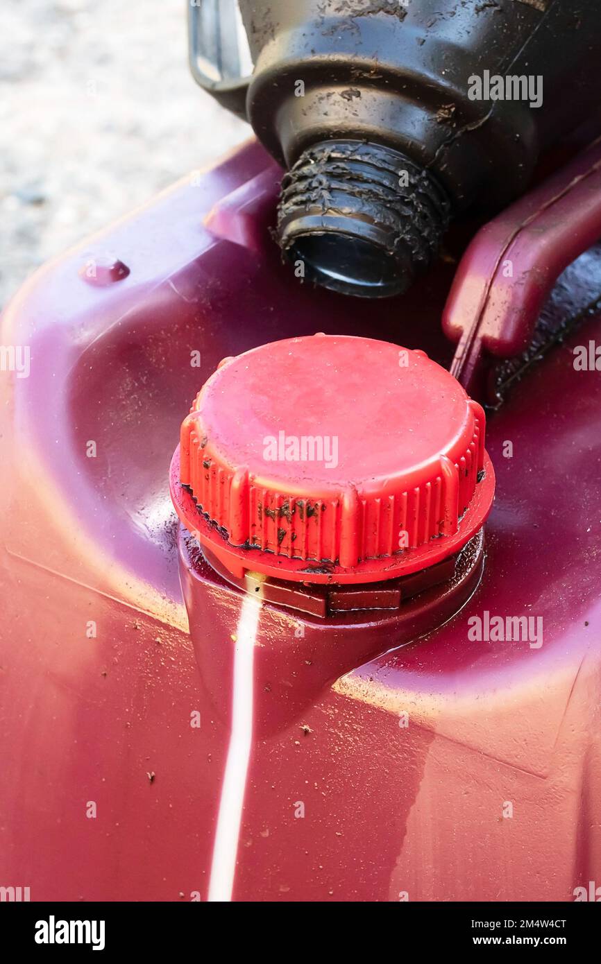 Large red canister of engine oil close up Stock Photo - Alamy