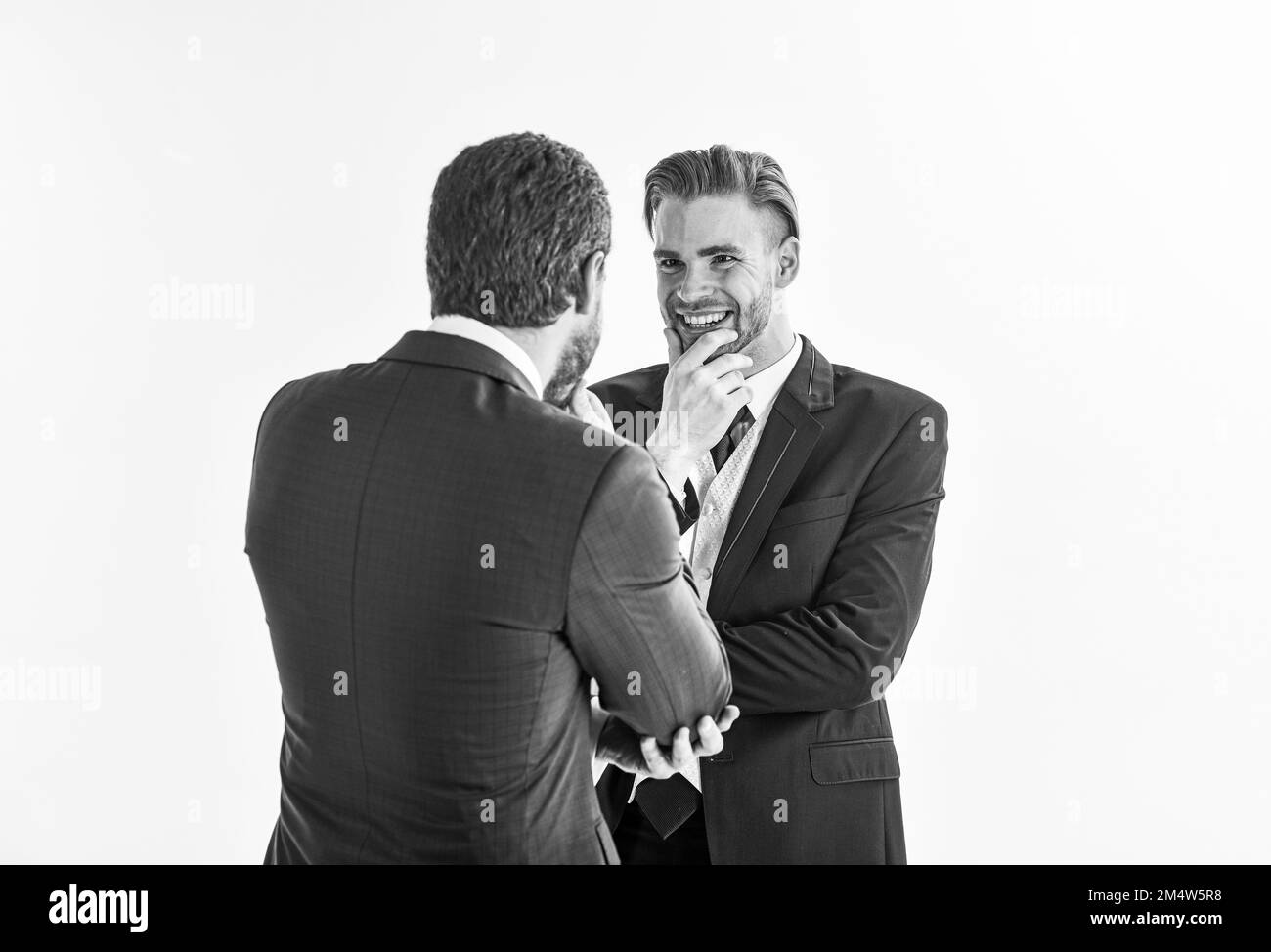 Partners with happy expression talking on white background Stock Photo ...