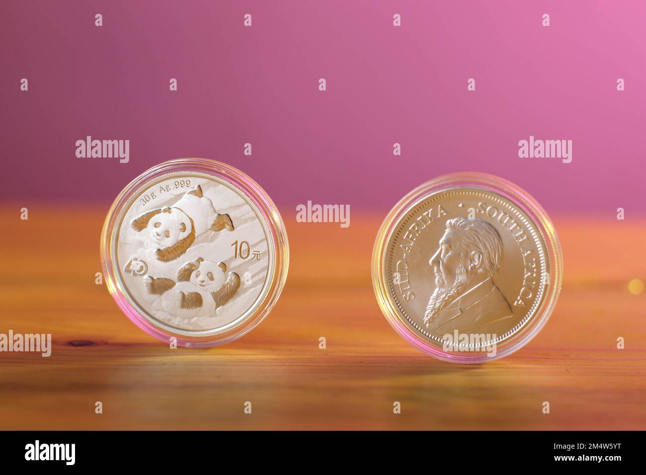 two silver coins side by side vertically 10 yuan and krugerrand on ...