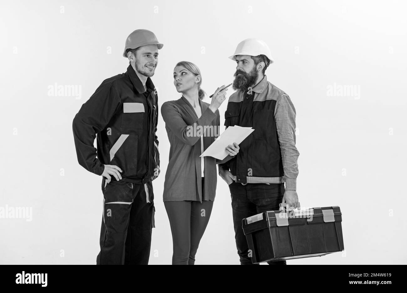 Female supervisor concept. Team of architects discussing plan Stock ...