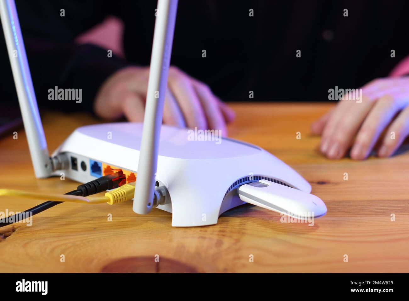 router with inserted gsm modem on the table and against the background ...