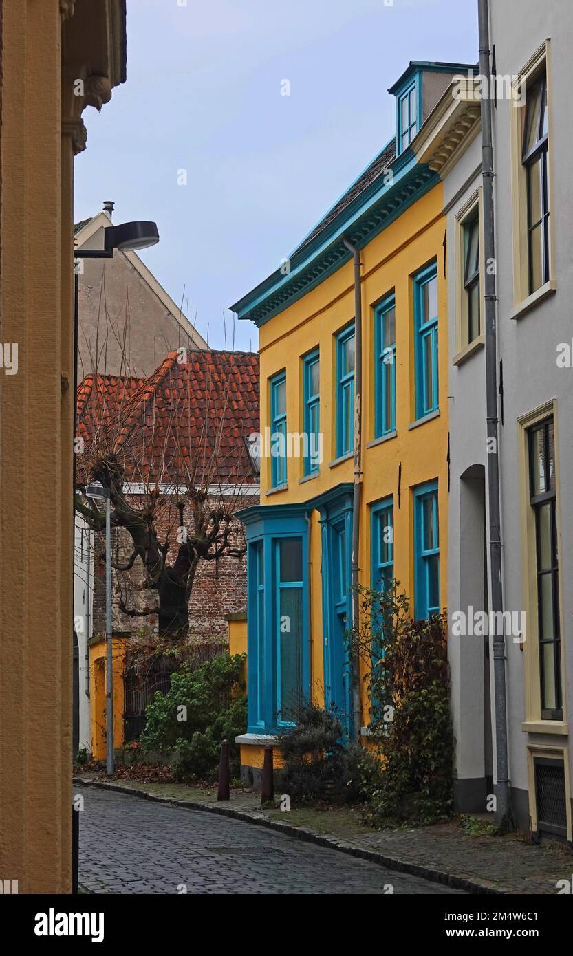 Bend street in Zutphen, the Netherlands. Traditional houses and a ...