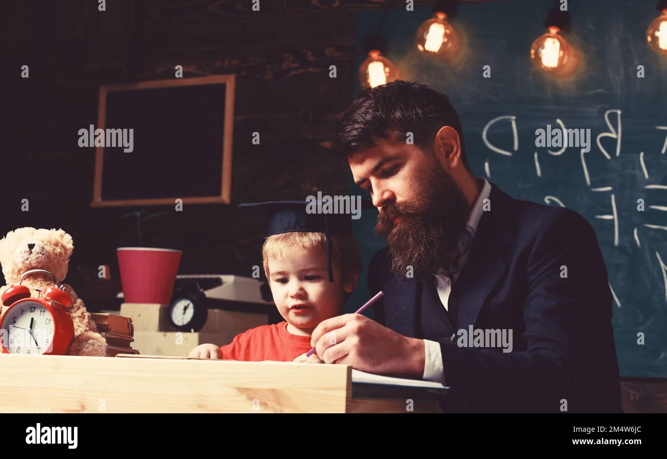 Individual studying concept. Busy kid studying at school. Father ...