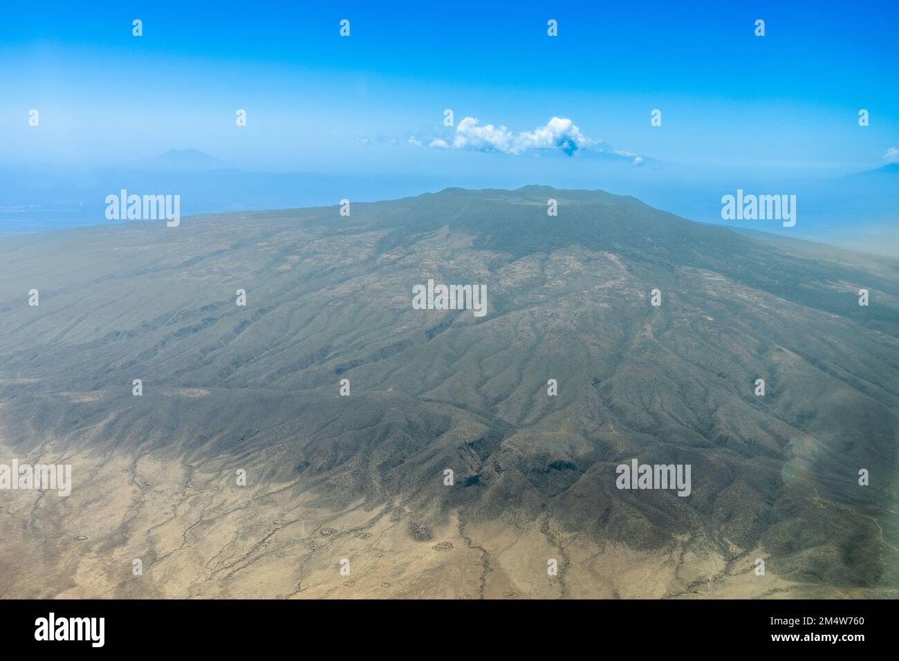 Aerial view of volcano craters in the Tanzanian Landscape Between ...