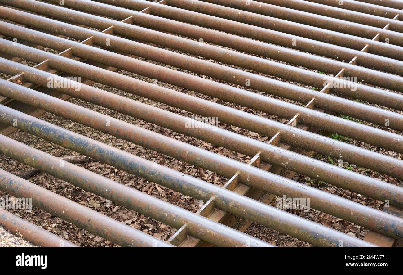 Rusty iron bar cattle grid example Stock Photo - Alamy
