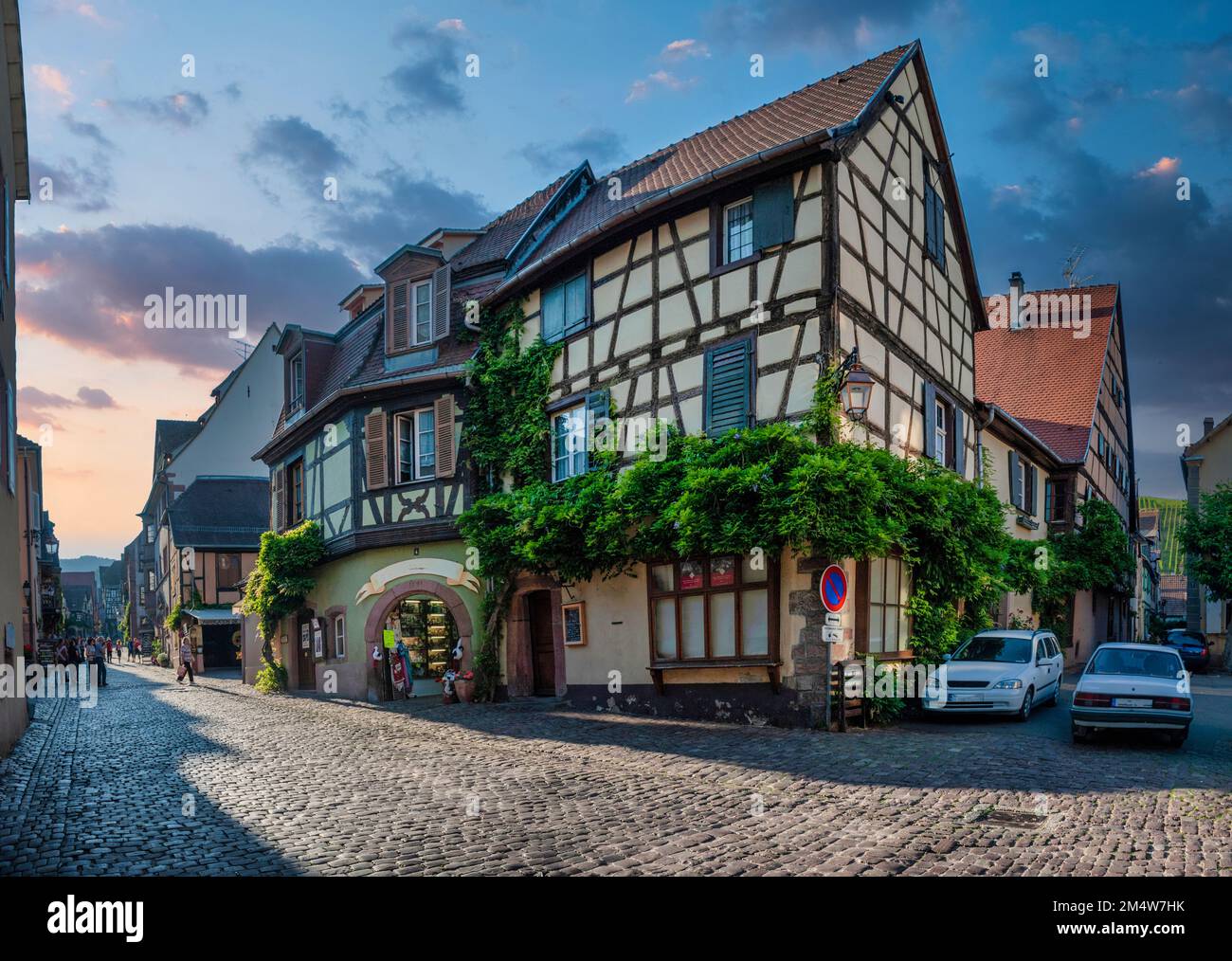 Traditional colorful half-timbered houses in Riquewihr village , Alsace ...