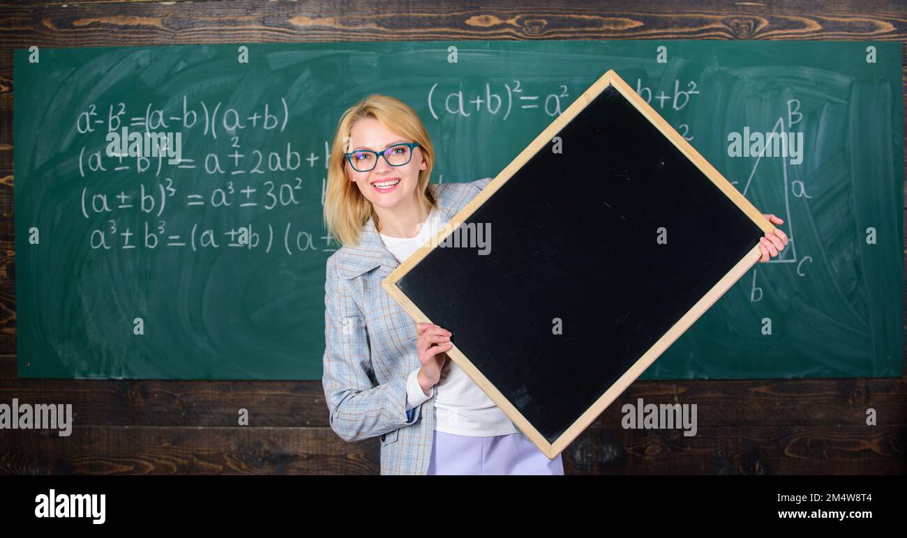 Remember this information. Teacher smart smiling woman hold blackboard ...