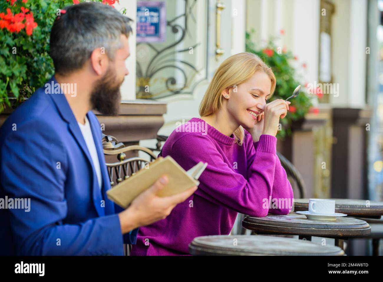 Meeting people with similar interests. Man and woman sit cafe terrace ...