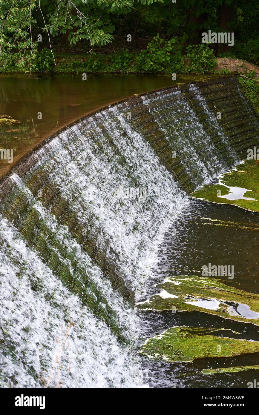 Water flowing over a steep waterfall wall Stock Photo - Alamy