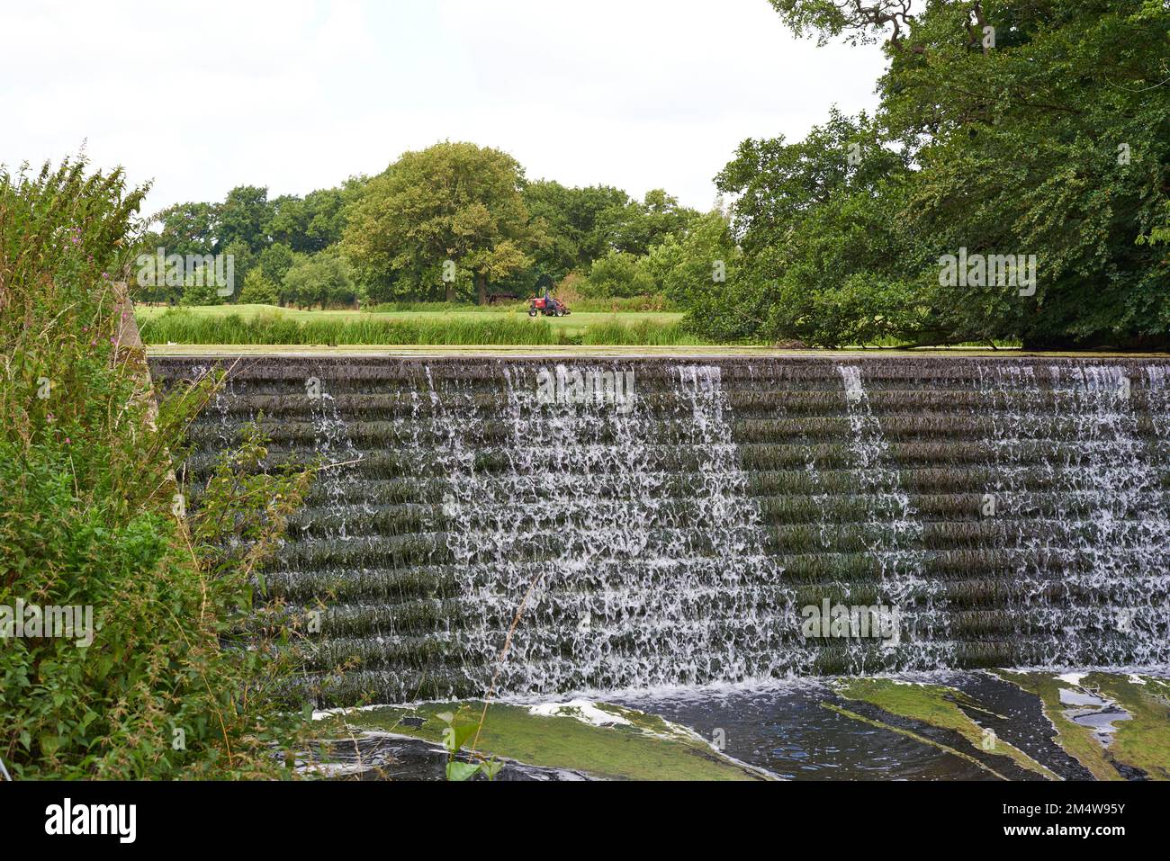 Water flowing over a steep waterfall wall Stock Photo - Alamy