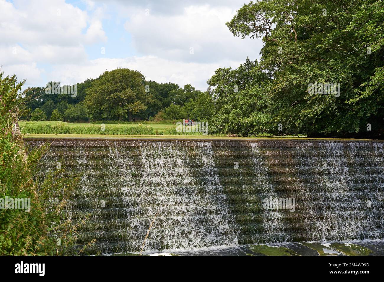 Water flowing over a steep waterfall wall Stock Photo - Alamy