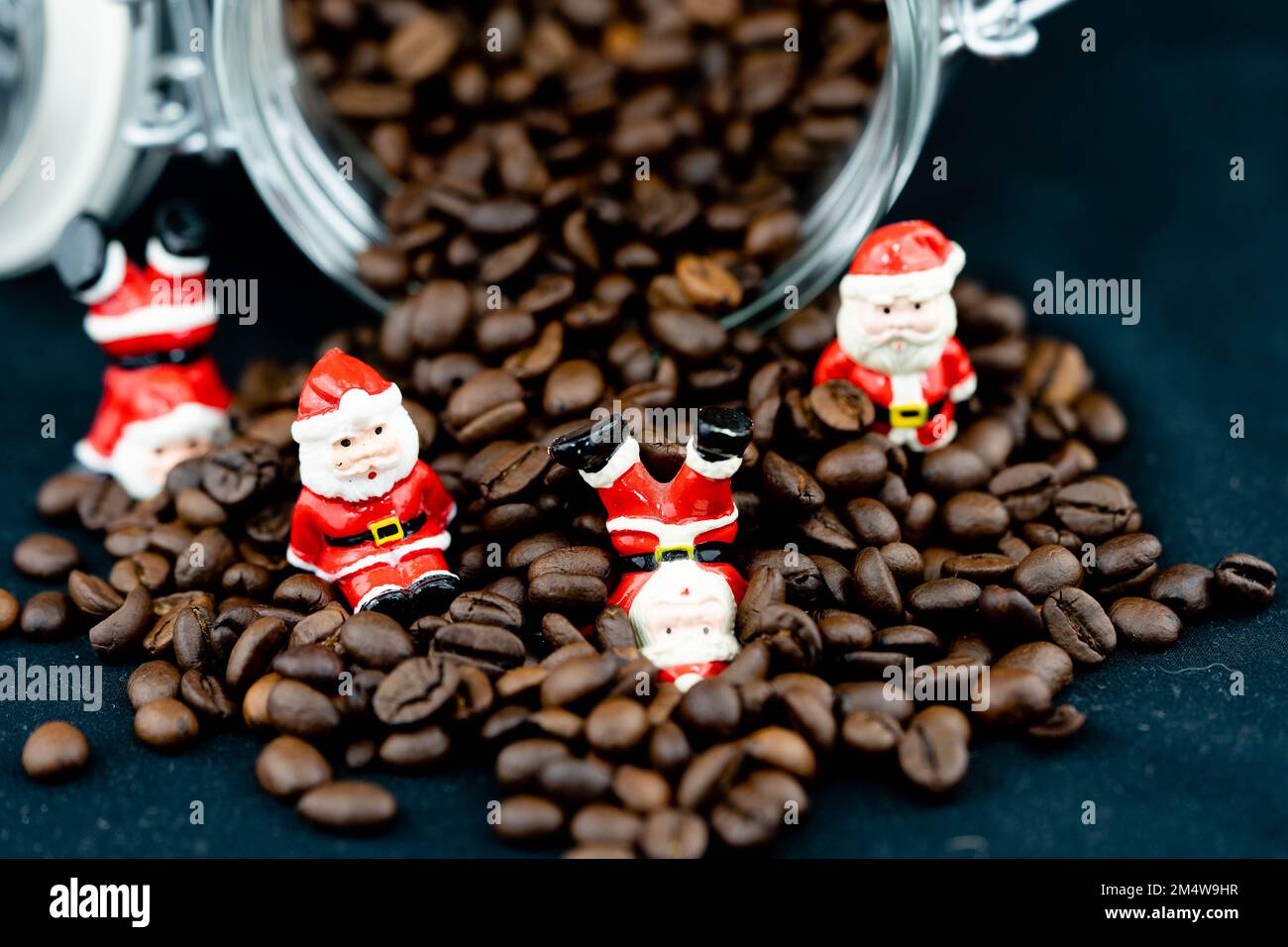 Santa Claus is sitting amid brown roasted coffee beans Stock Photo - Alamy