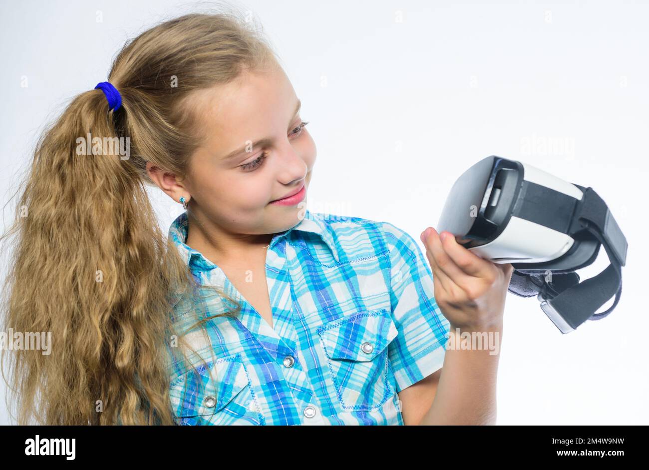 Digital future and innovation. Little girl wearing virtual reality ...