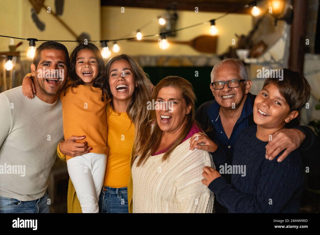 Happy Hispanic family enjoying holidays together at home Stock Photo ...