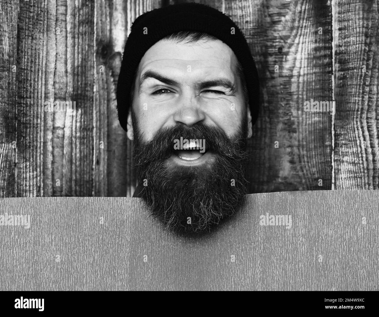 Bearded brutal caucasian hipster with red paper sheet Stock Photo - Alamy